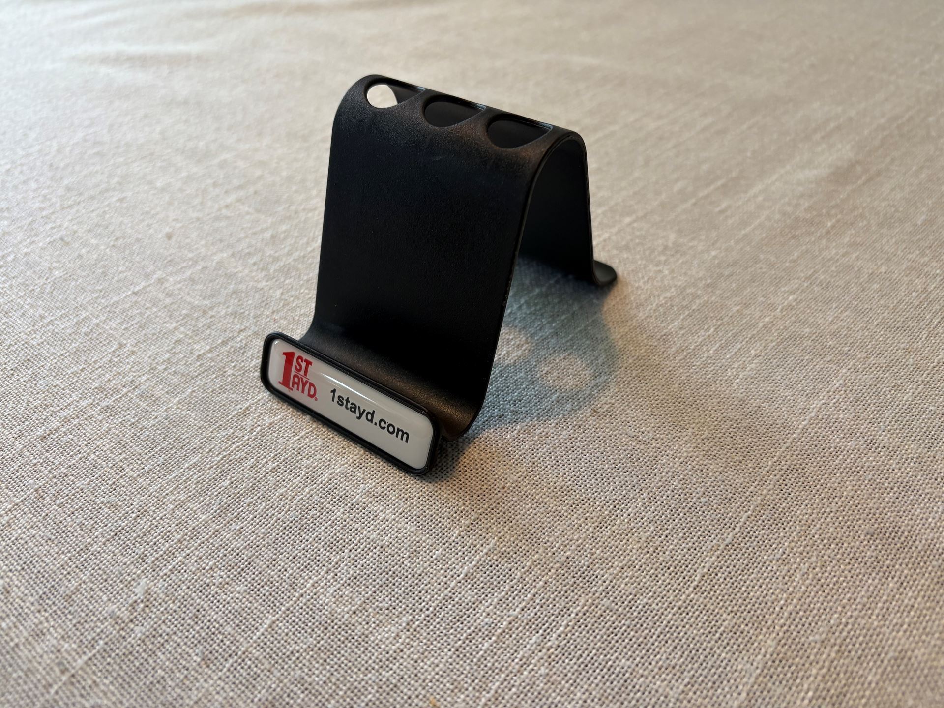 1st Ayd Corporation. Cell Stand Black with 1st Ayd Logo
